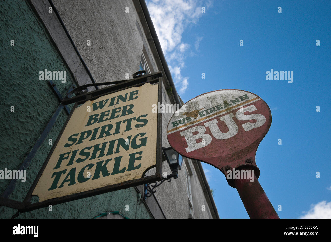 Bus stop beside bar which sells fishing tackle Stock Photo - Alamy