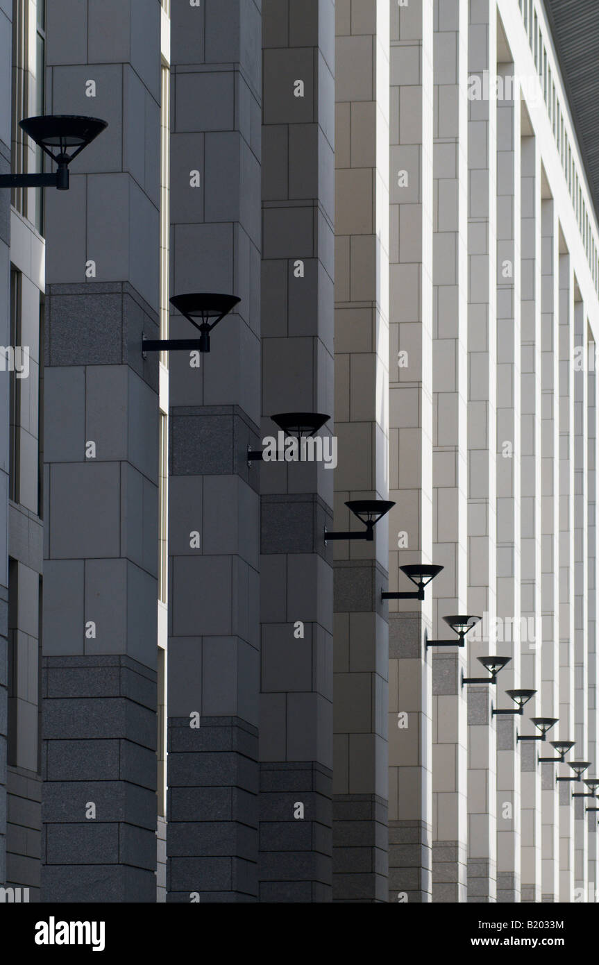 A row of columns fading out of the light Stock Photo - Alamy