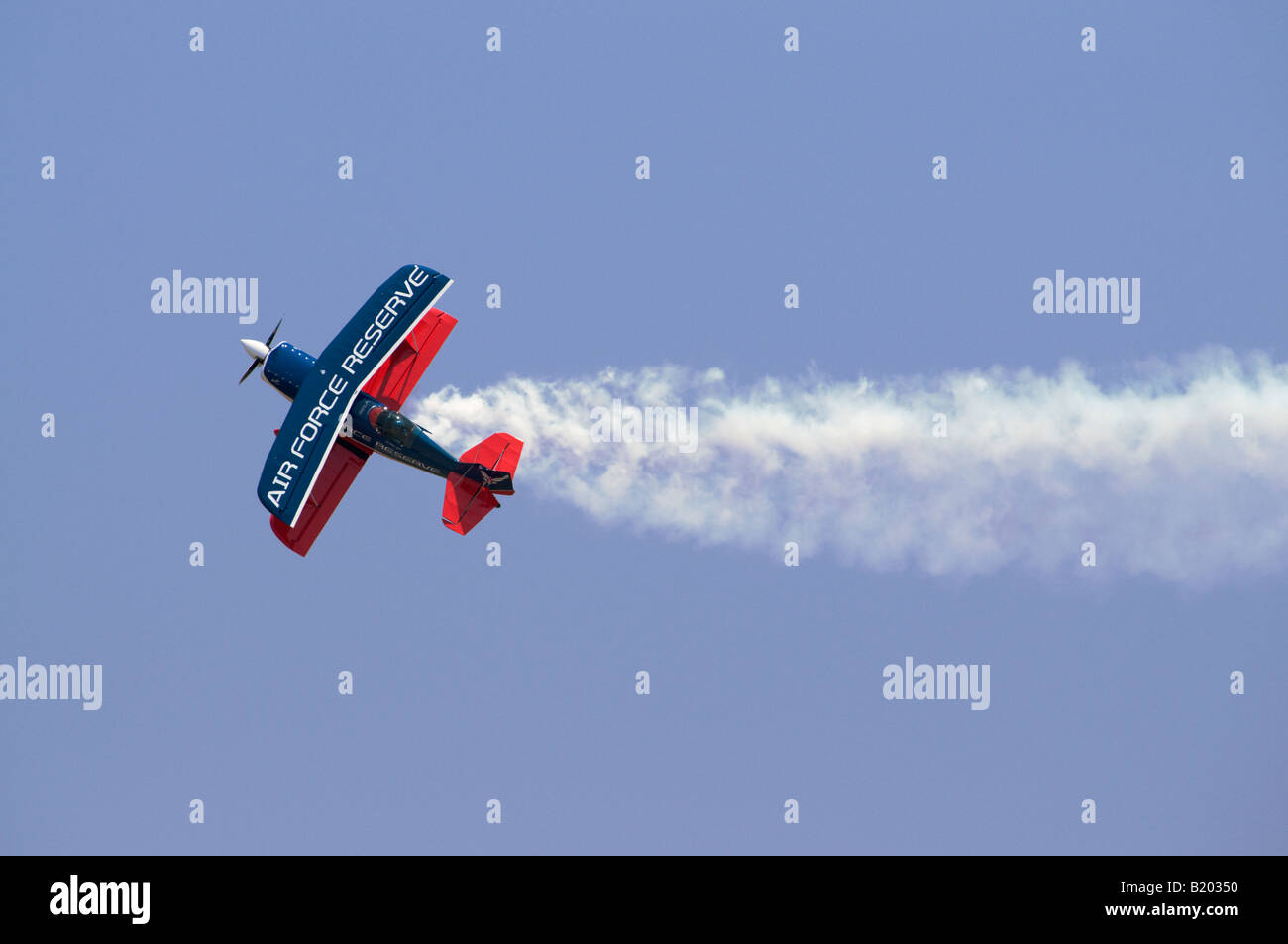 A bi-plane performing at an air show Stock Photo - Alamy