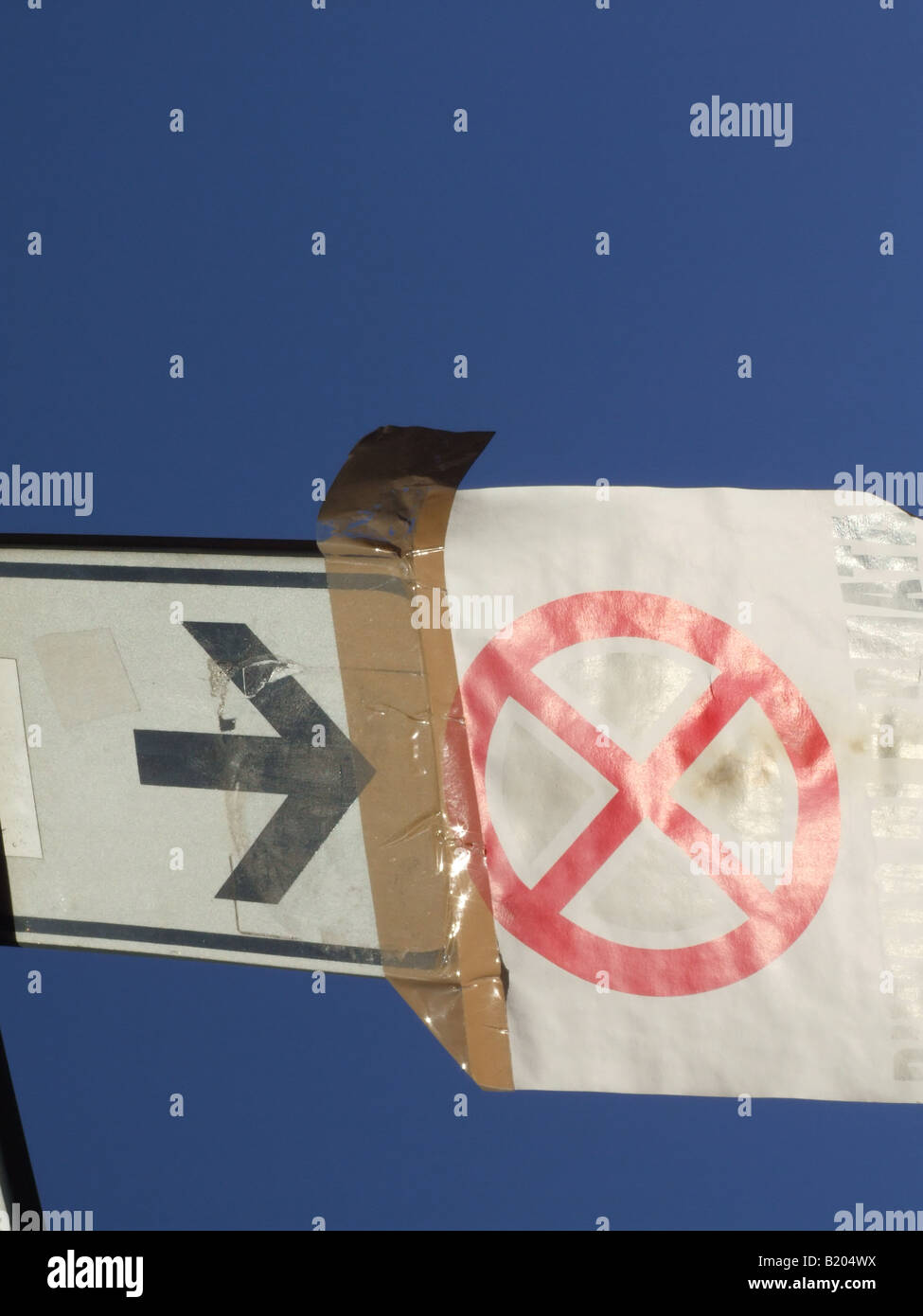 no stopping road traffic sign with arrow Stock Photo - Alamy