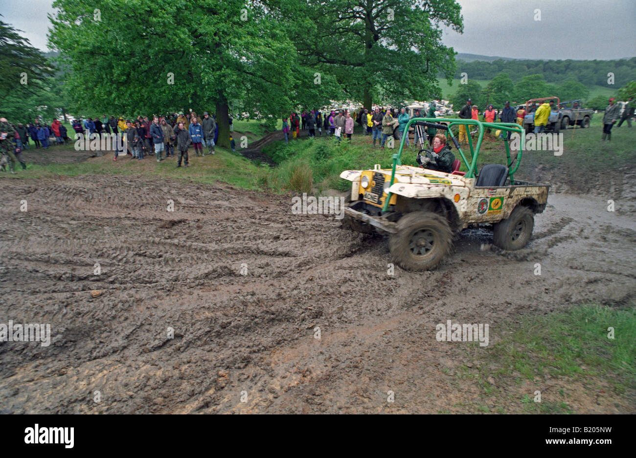 Woman competing with a Land Rover Series 1 based off-road racer at ...