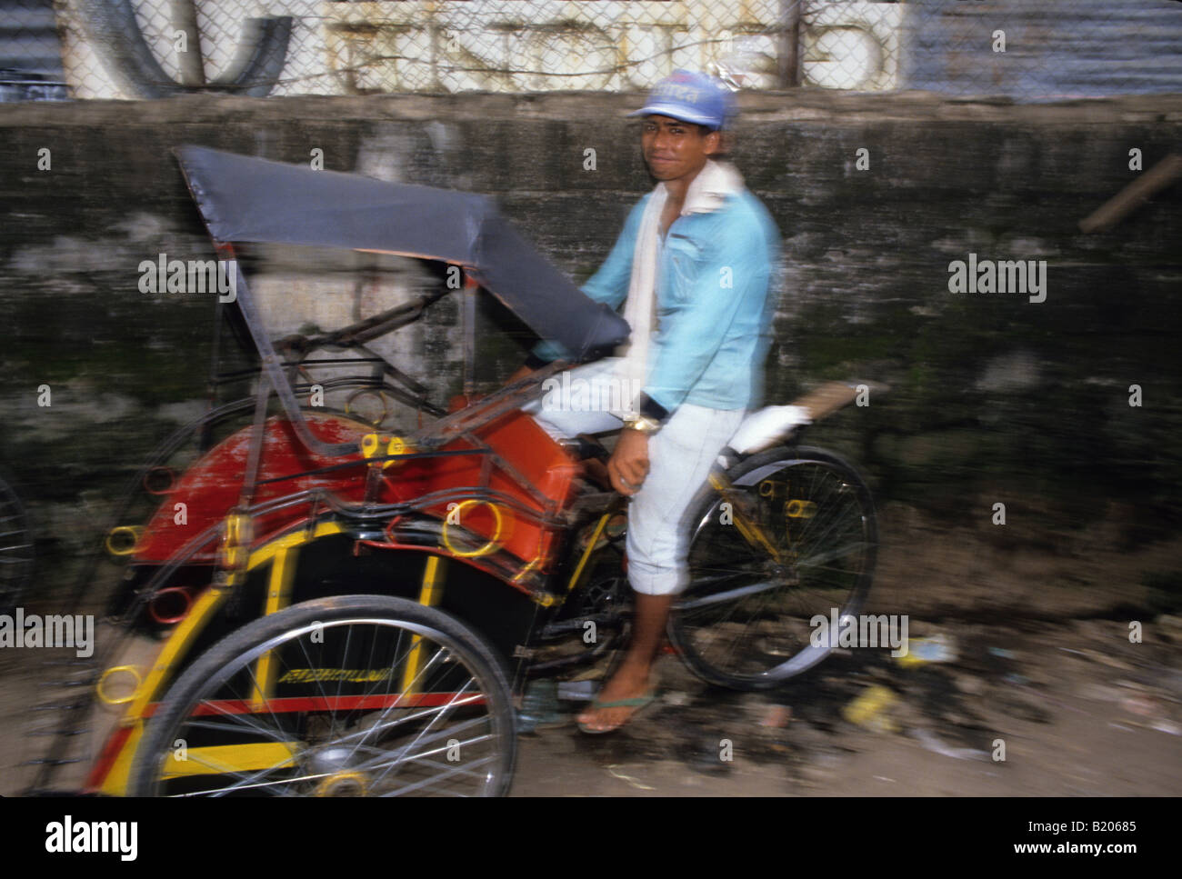 Rickshaw and rickshaw driver Jakarta Java Indonesia Stock Photo - Alamy
