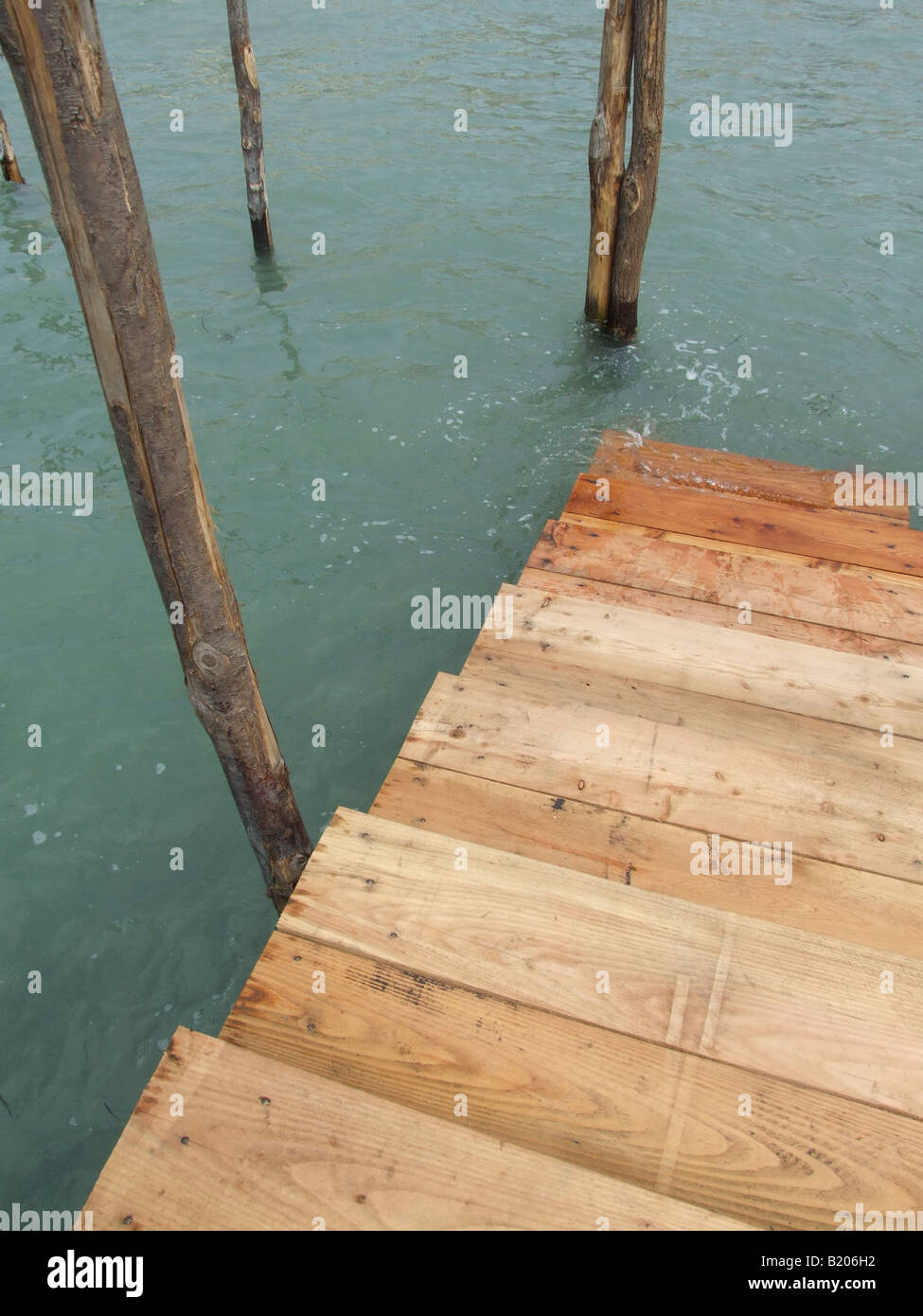 small wooden jetty steps by sea water Stock Photo - Alamy