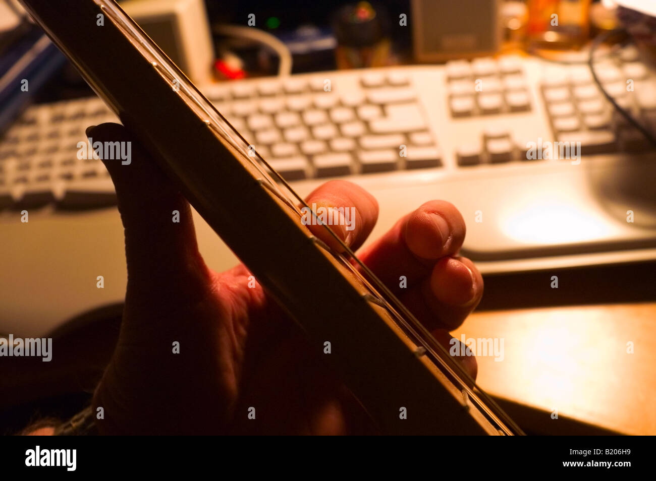 Guitarist with Computer Keyboard Stock Photo - Alamy