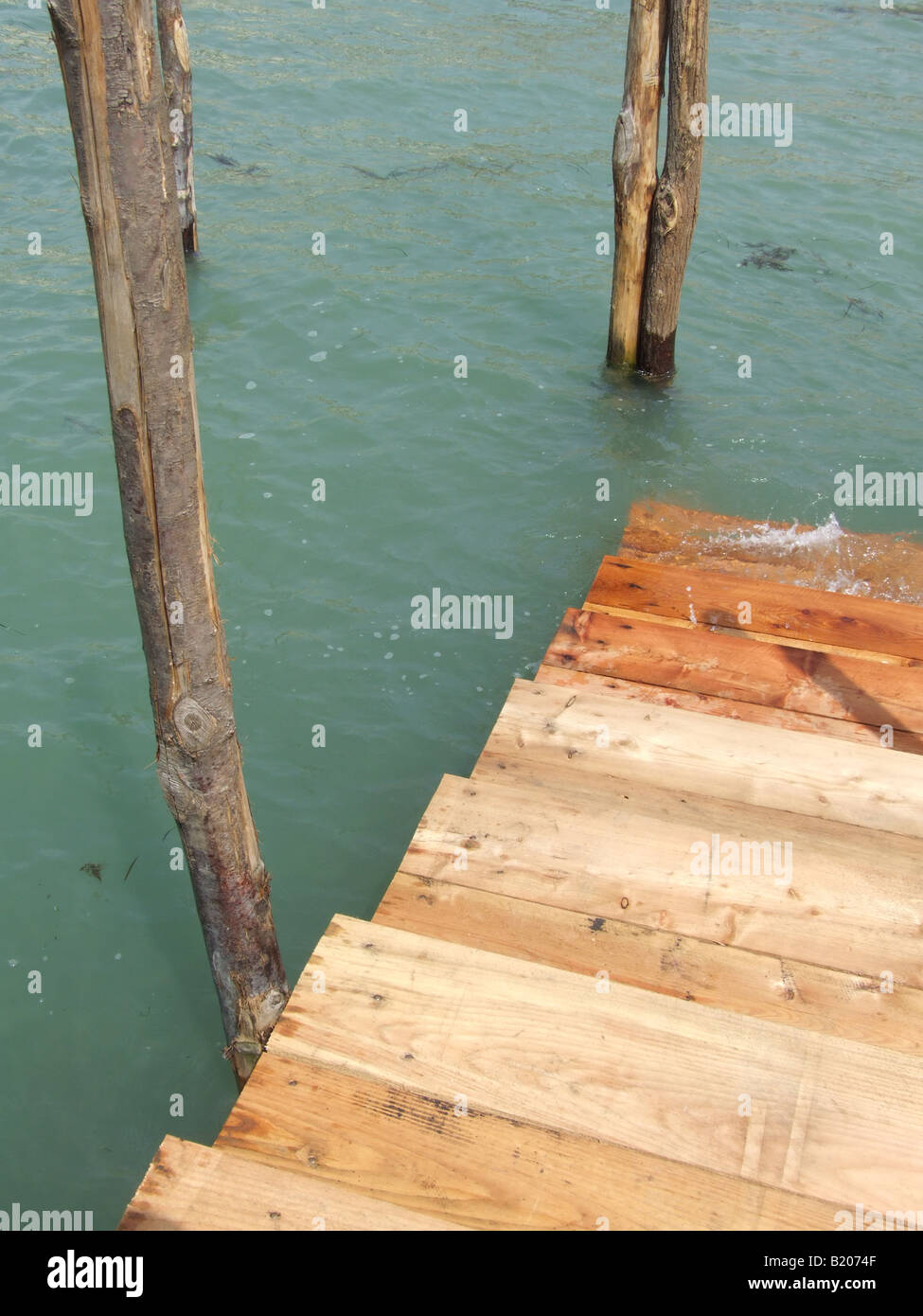 small wooden jetty steps by sea water Stock Photo - Alamy
