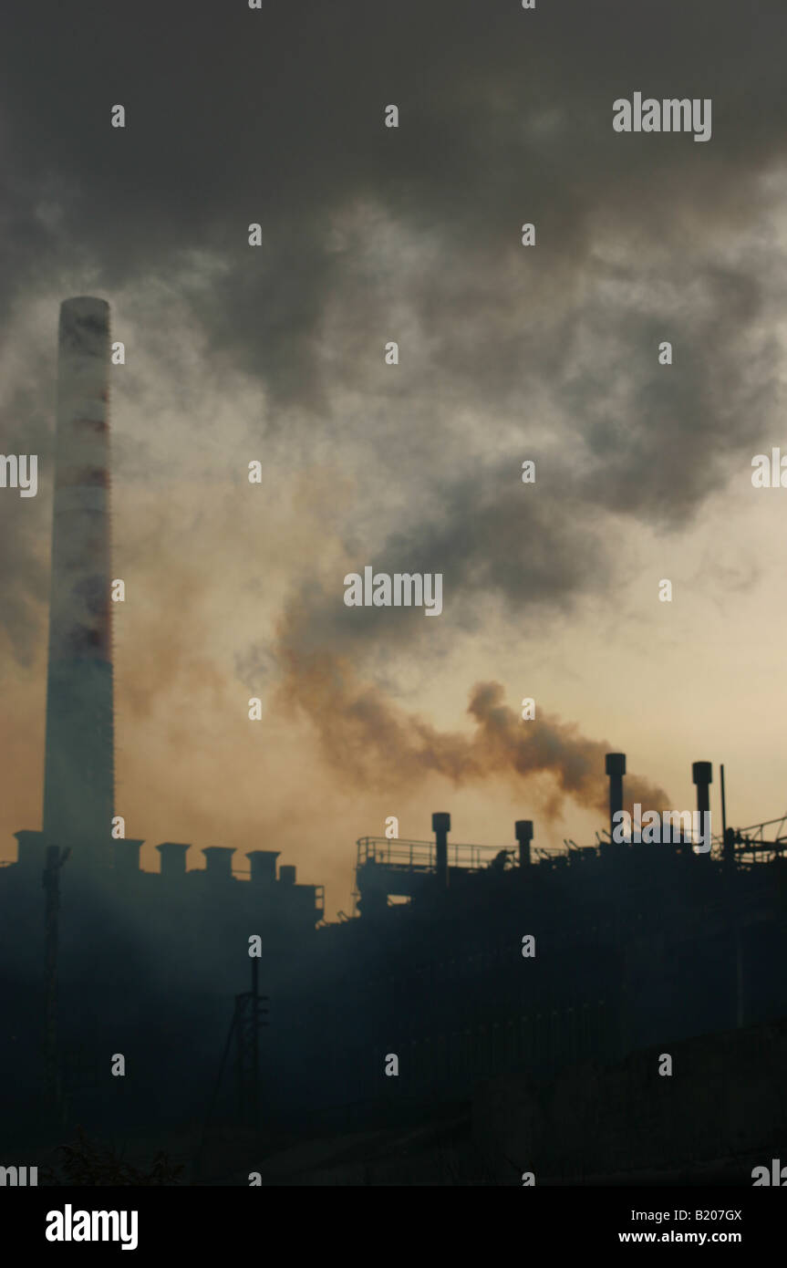 A working factory in the sunset Stock Photo - Alamy