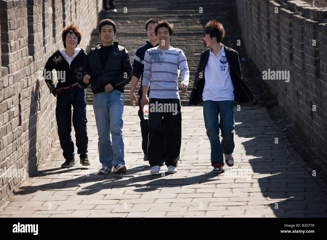 Chinese male youths walk the Great Wall of China at Mutianyu north of ...