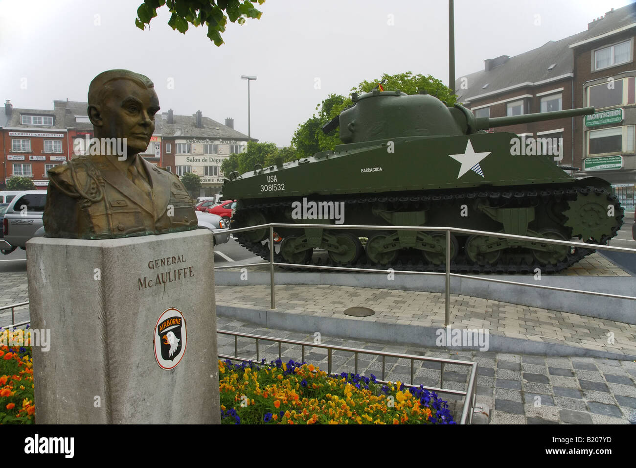 Bastogne, Belgium. A statue of General Anthony McAuliffe near a Sherman ...