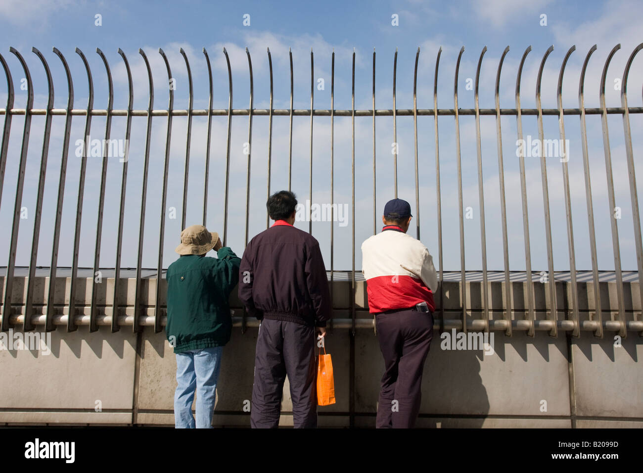 People behind barrier High Resolution Stock Photography and Images - Alamy