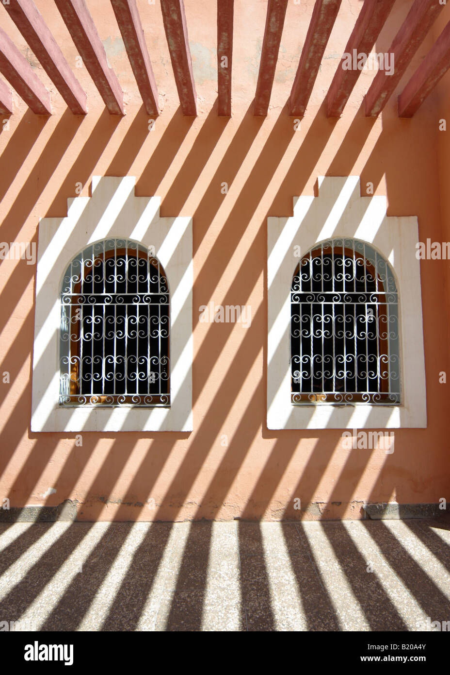 Diagonal pattern of shadows across wall and windows of building Stock ...