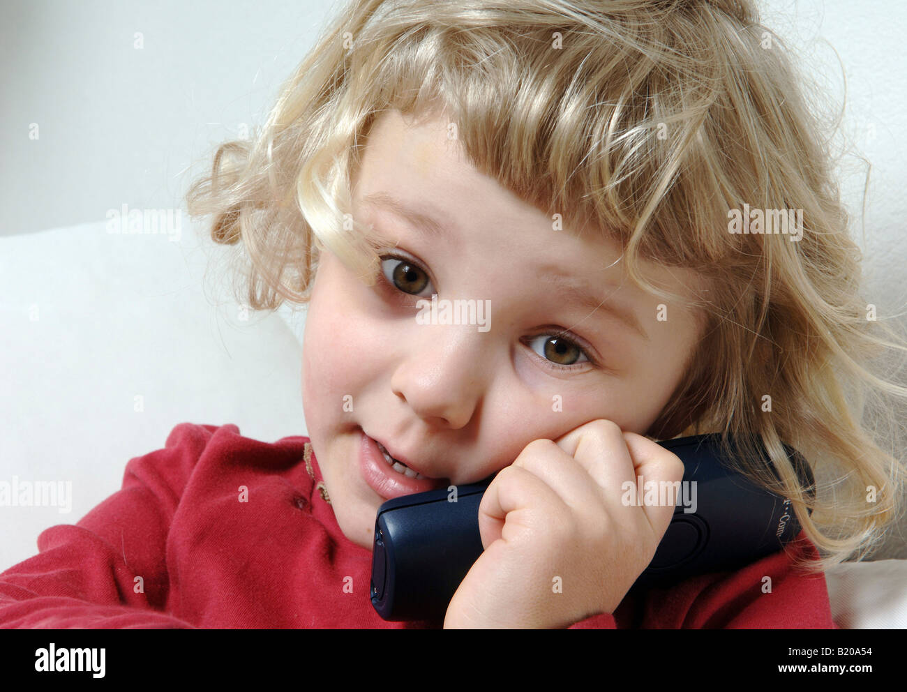 Kid making a phone call Stock Photo - Alamy