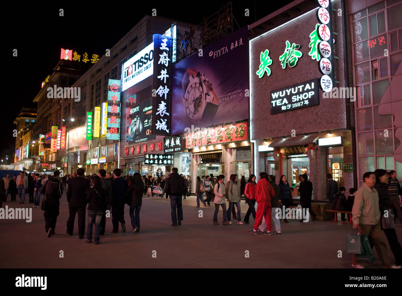 Crowded pavement and shops of Wangfujing Street Beijing China Stock ...