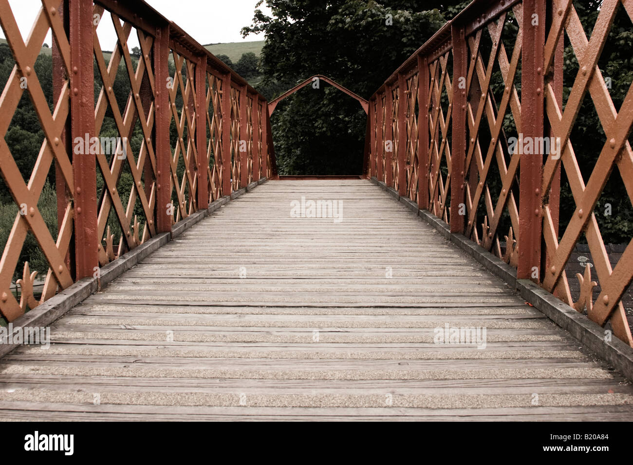 Iron footbridge over railway Stock Photo - Alamy