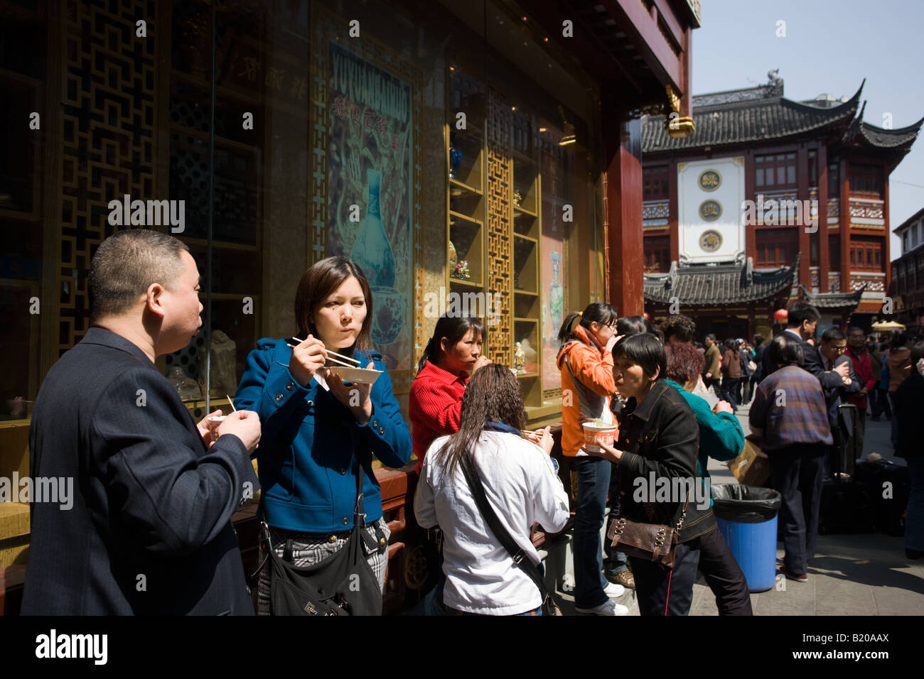 People eating street food in the Yu Garden Bazaar Market Shanghai China ...