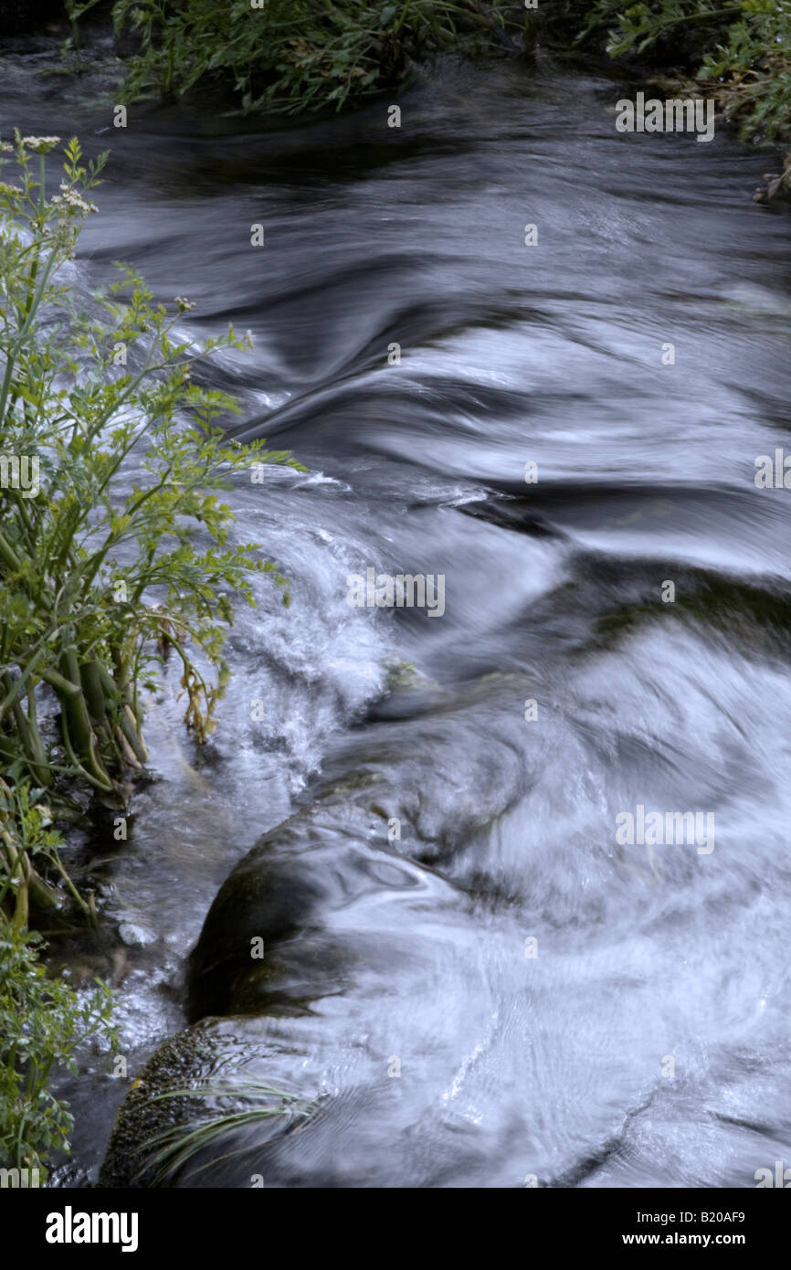 Stream flowing over granite riverbed Stock Photo - Alamy