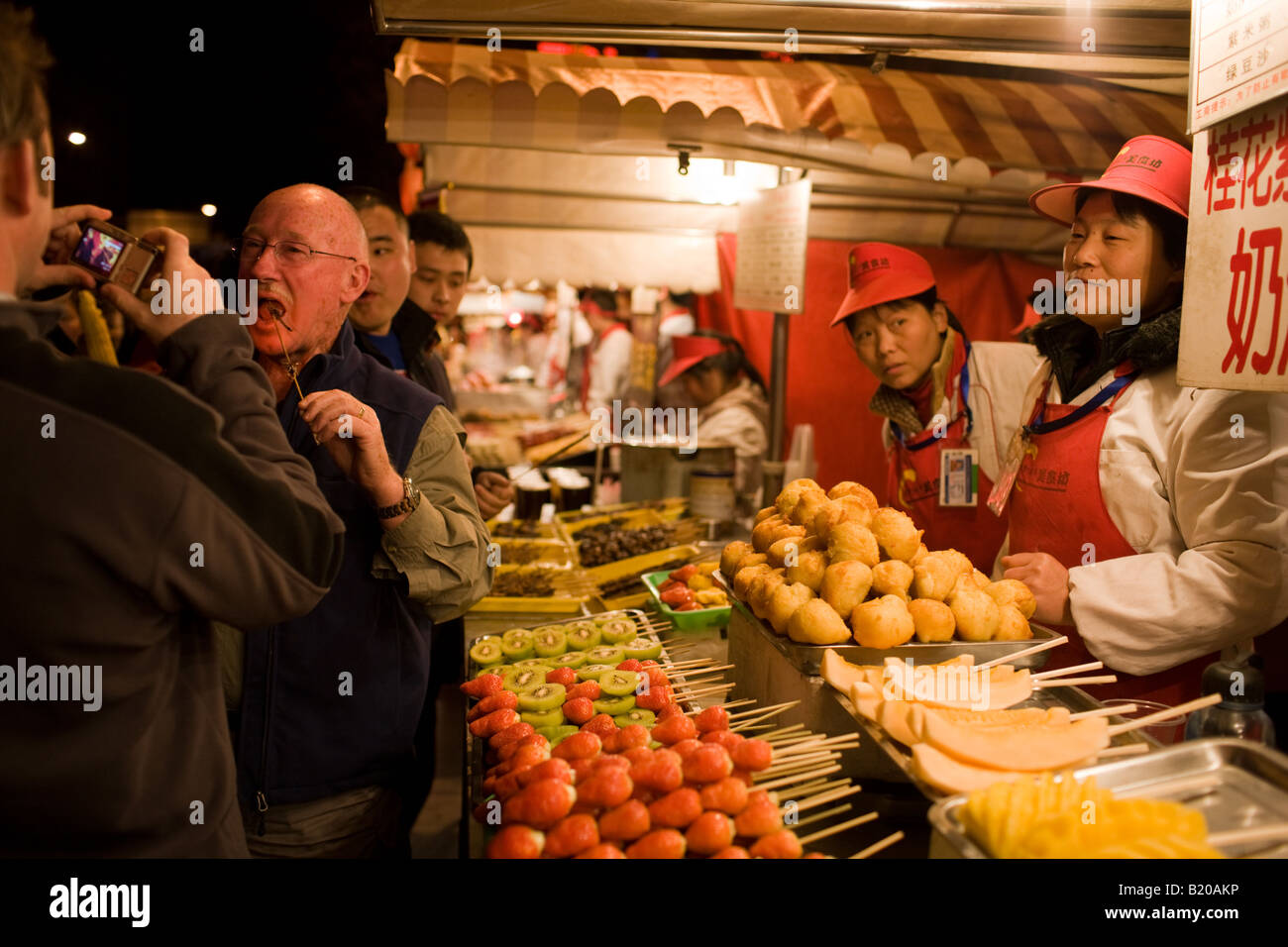 Tourists try Chinese snacks in the Night Market Wangfujing Street ...