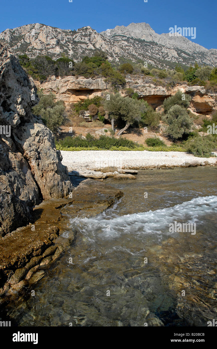 Hidden Fangri (Fakri) Beach in the west of the island. Kerkis mountain ...