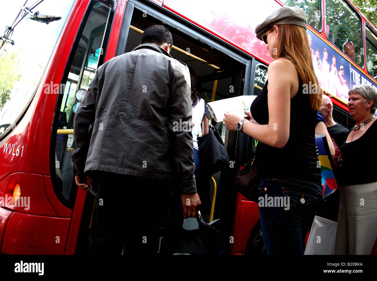 Passengers boarding modern double decker bus in London Stock Photo - Alamy