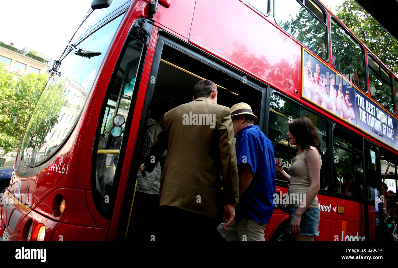 Passengers board modern double decker bus in London Stock Photo - Alamy