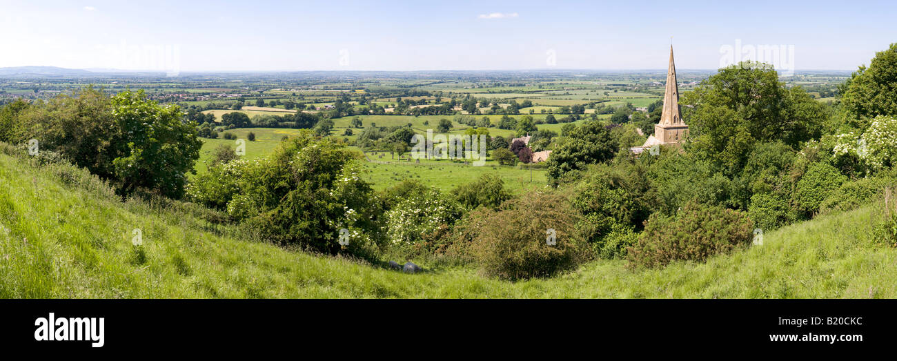 Looking across St Nicholas church in the Cotswold village of Saintbury ...