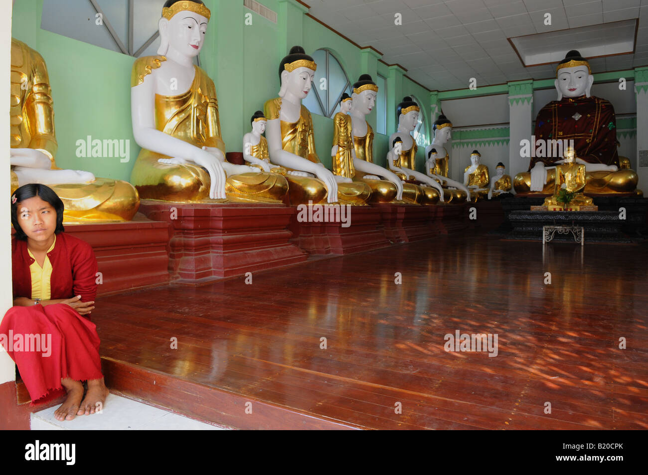 poor karen girl sitting at entrance to temple , shwedagon pagoda ...