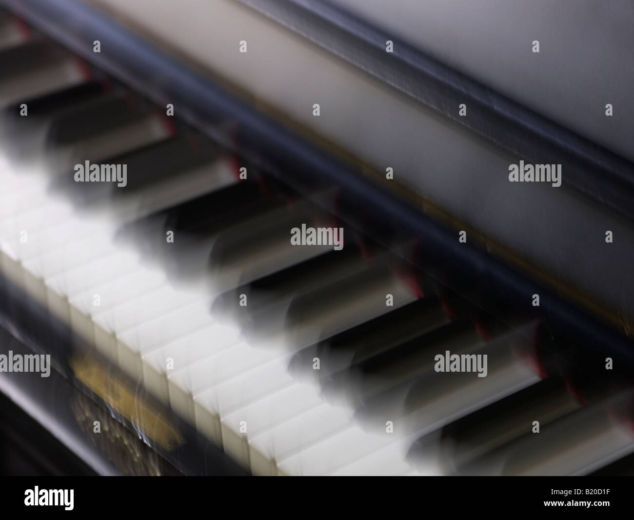 Piano keys in motion Stock Photo - Alamy