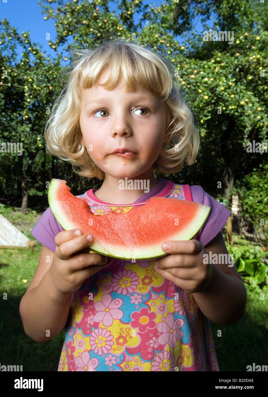Kid eating a watermelon Stock Photo - Alamy