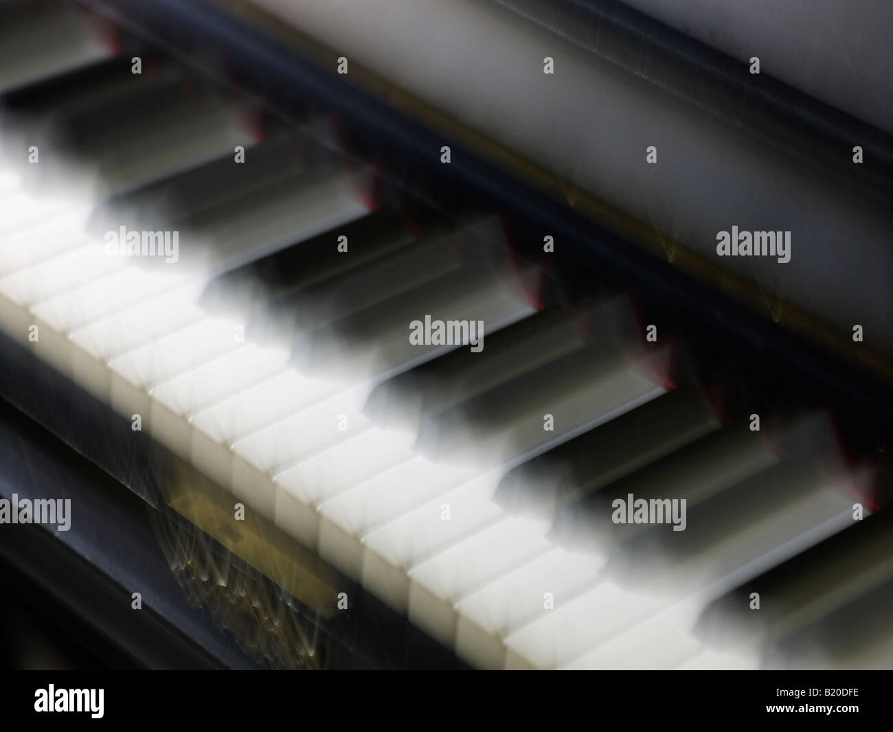 Piano keys in motion Stock Photo - Alamy