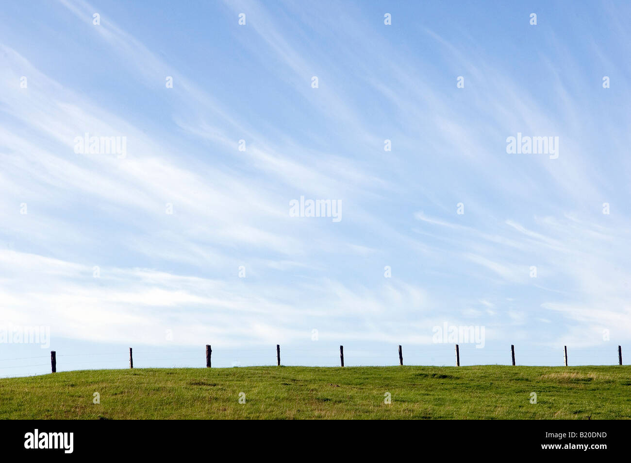 Sky, meadow and a fence Stock Photo - Alamy
