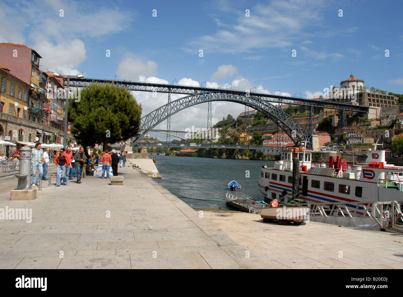 Praca de Ribeira waterfront in Oporto,Portugal with the Ponte de D ...