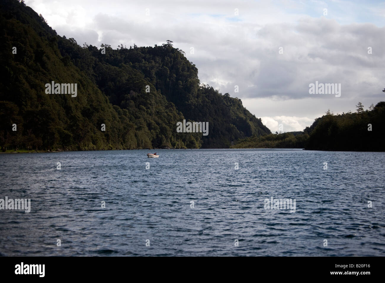 Man boating on Lake Todos los Santos Chile Stock Photo - Alamy