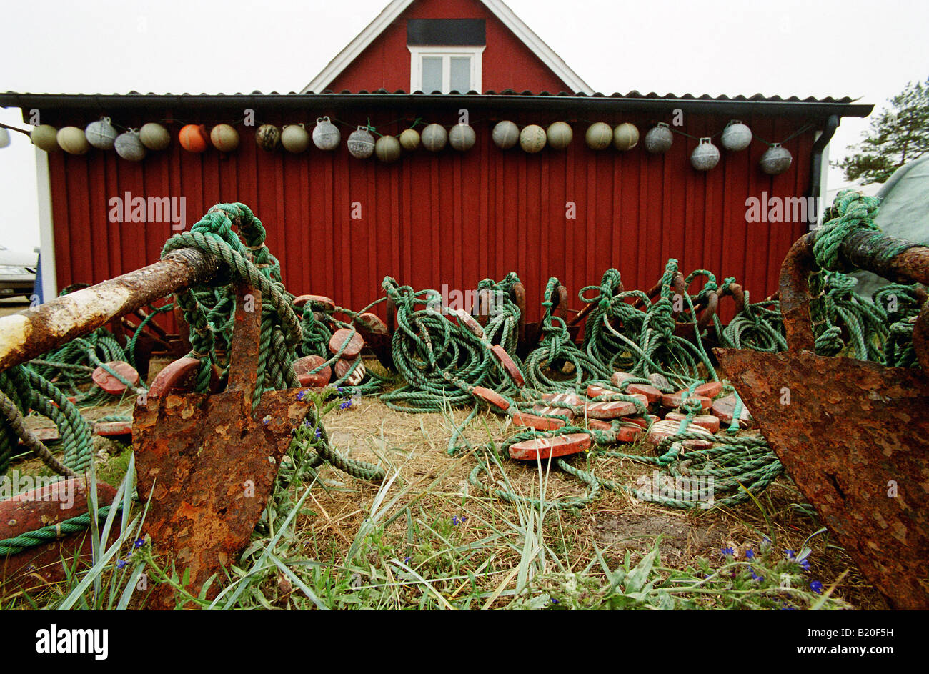 Fishing nets and anchors Stock Photo - Alamy