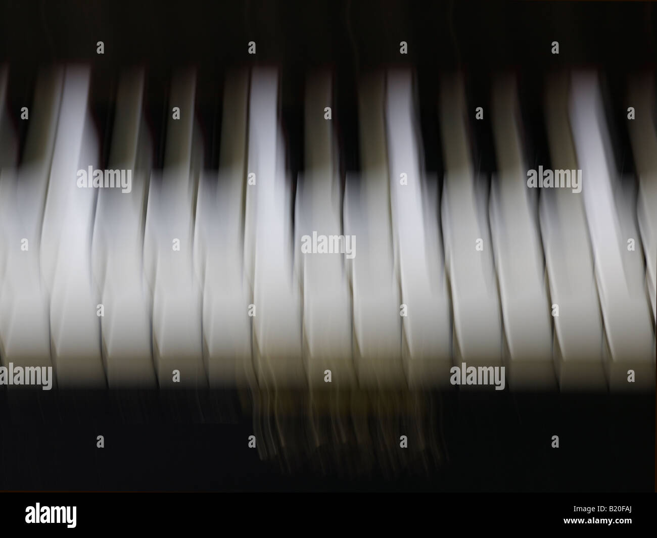 Piano keys in motion Stock Photo - Alamy