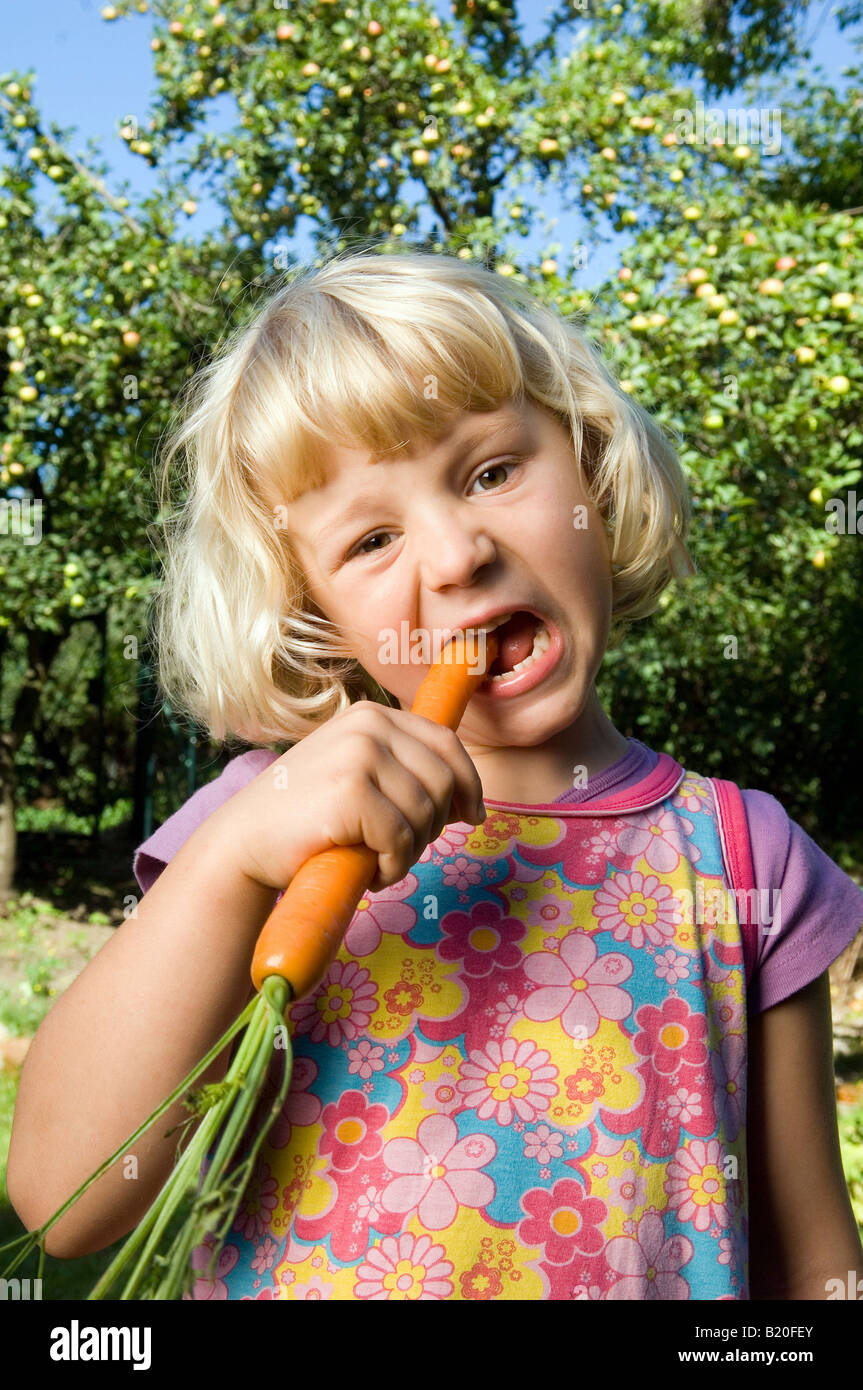 Child bite carrot hi-res stock photography and images - Alamy
