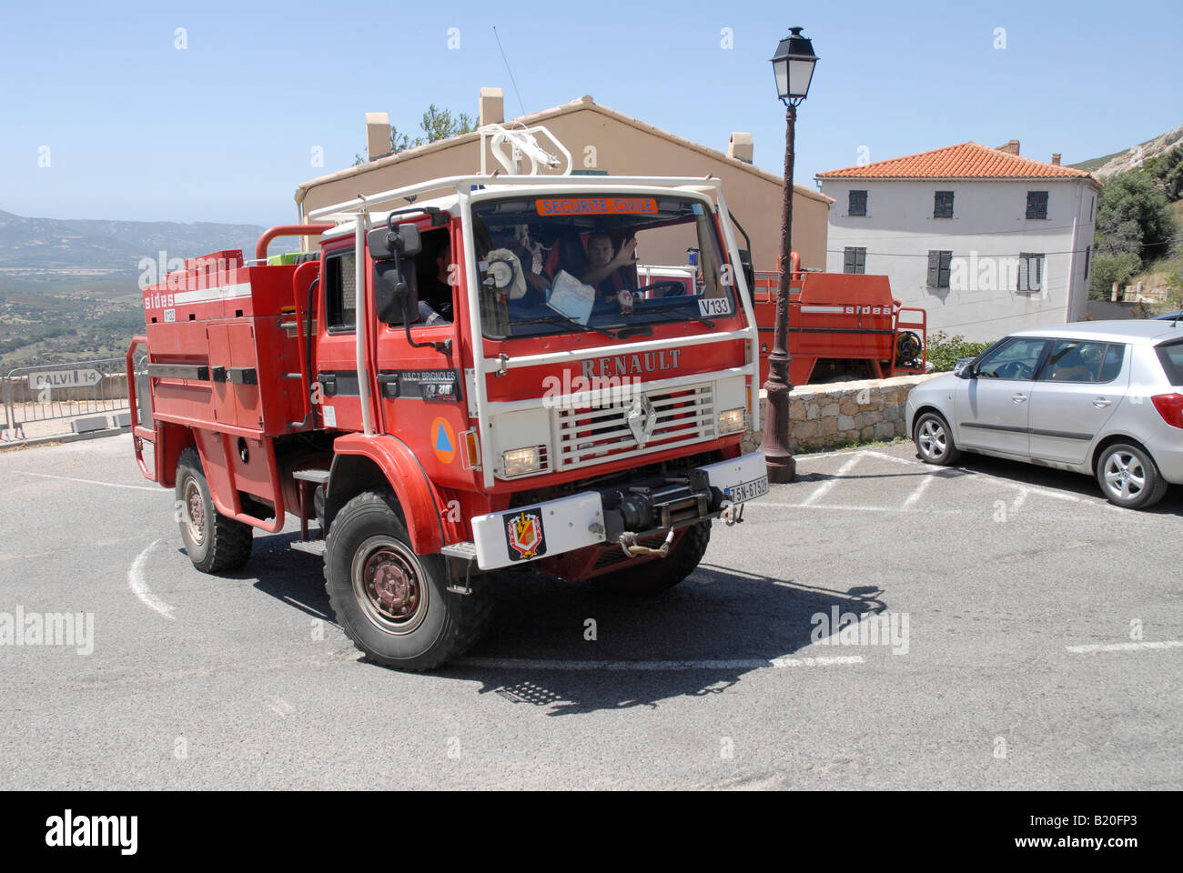 Fire emergency rescue vehicle travelling through the mountain village ...