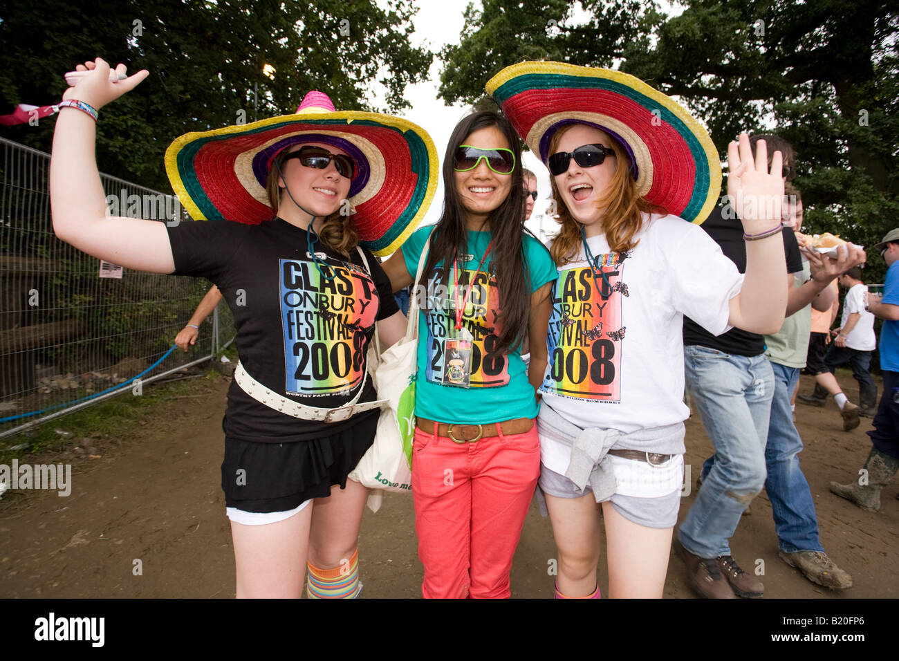 Girls wearing the official festival t shirt at the Glastonbury Festival ...