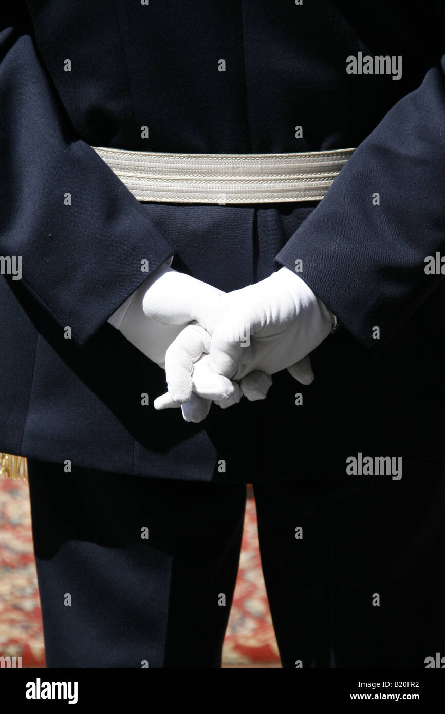 man in uniform with gloves hands behind back Stock Photo - Alamy