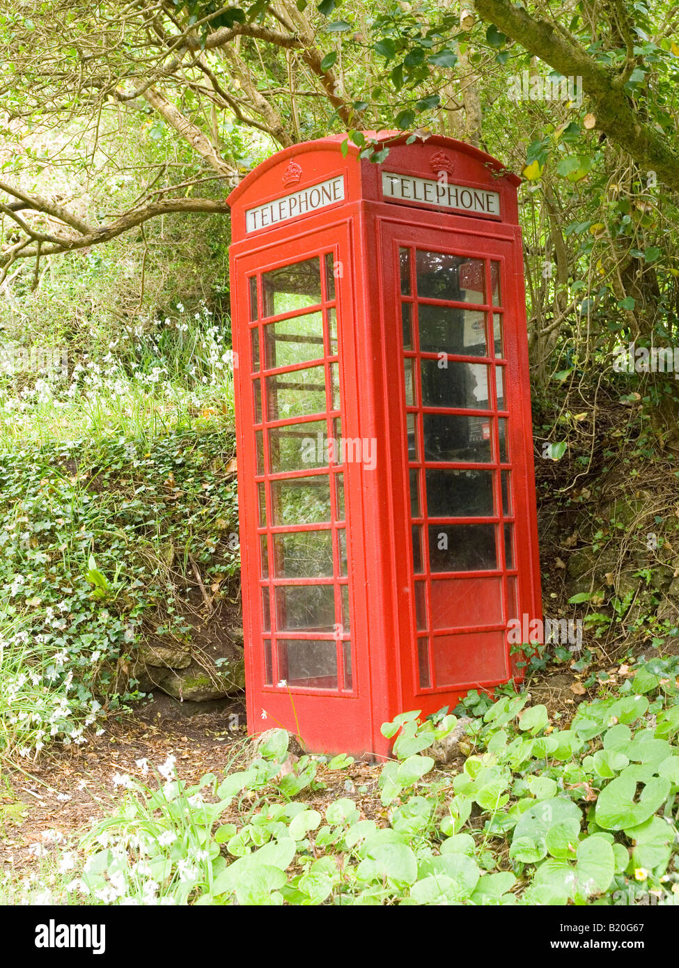 A traditional red telephone box in the pretty village of Penberth Cove ...