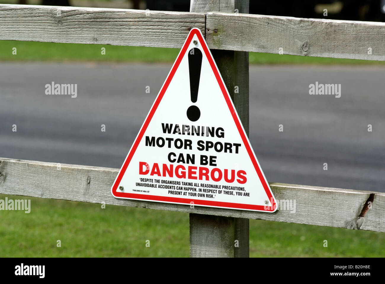 Danger sign on fence motor racing hi-res stock photography and images ...