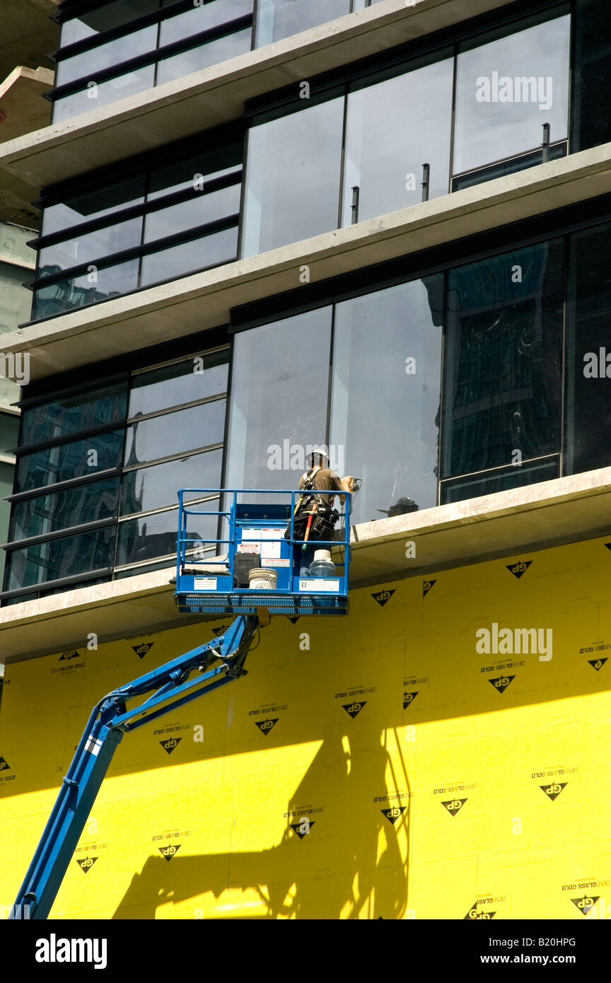 Man in construction "man-lift" performing work activities Stock Photo ...