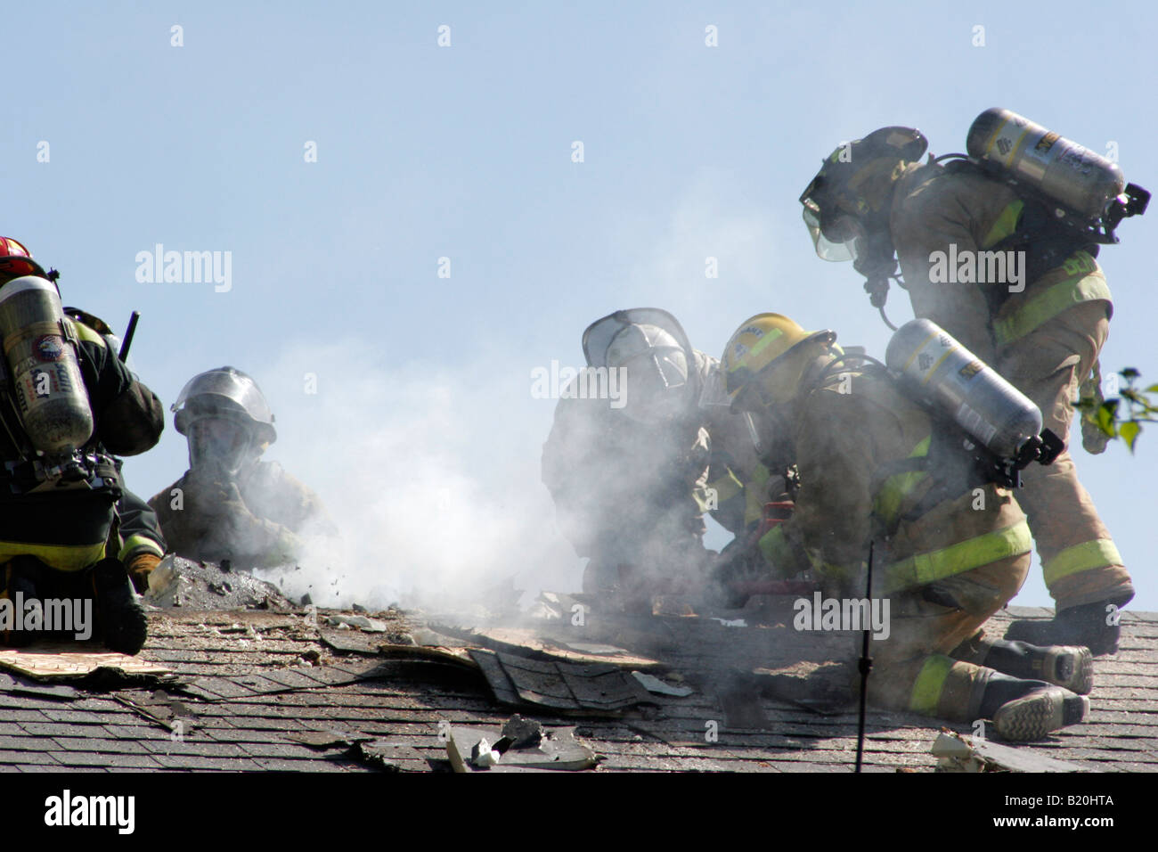 Firefighters on the roof of a church on fire Stock Photo - Alamy
