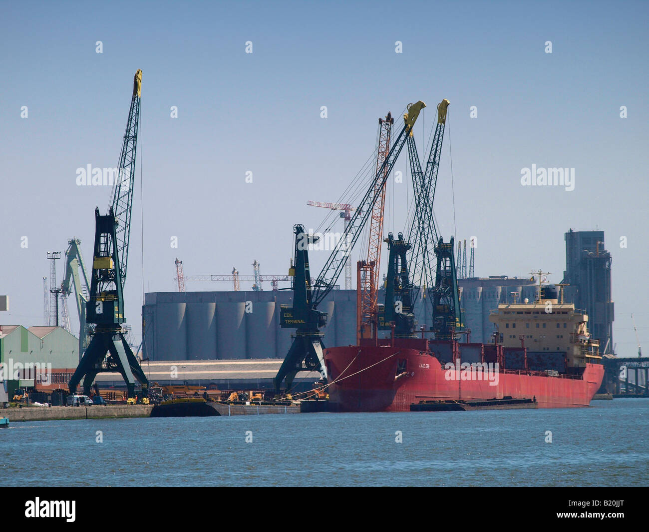 Seaport of Antwerp with cranes and big cargo ship Coil terminal Antwerp ...
