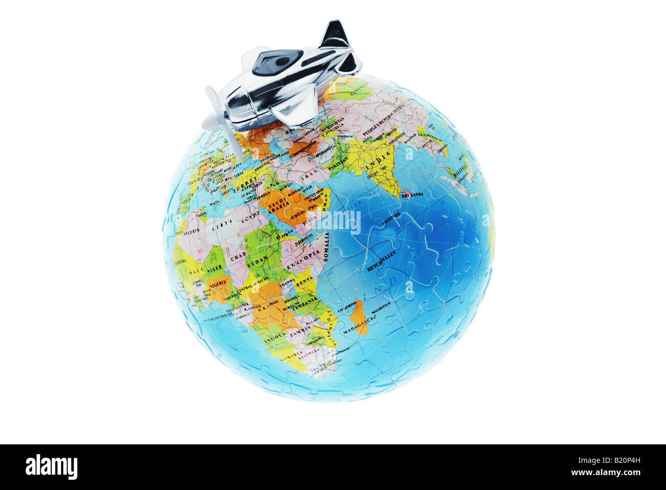 Miniature toy aircraft on top of globe Stock Photo - Alamy