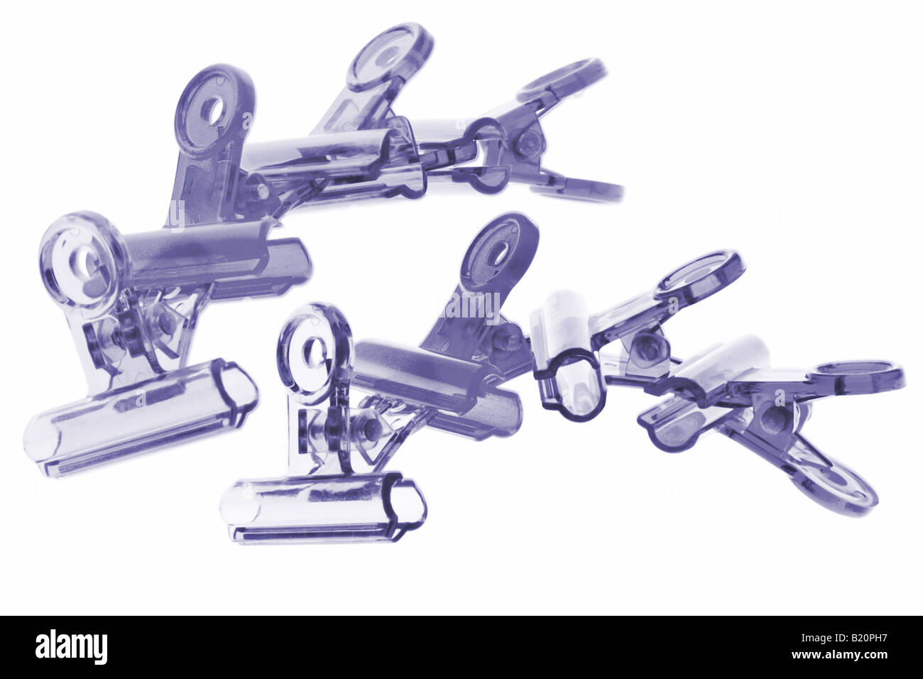 Plastic paper clips on white background Stock Photo - Alamy