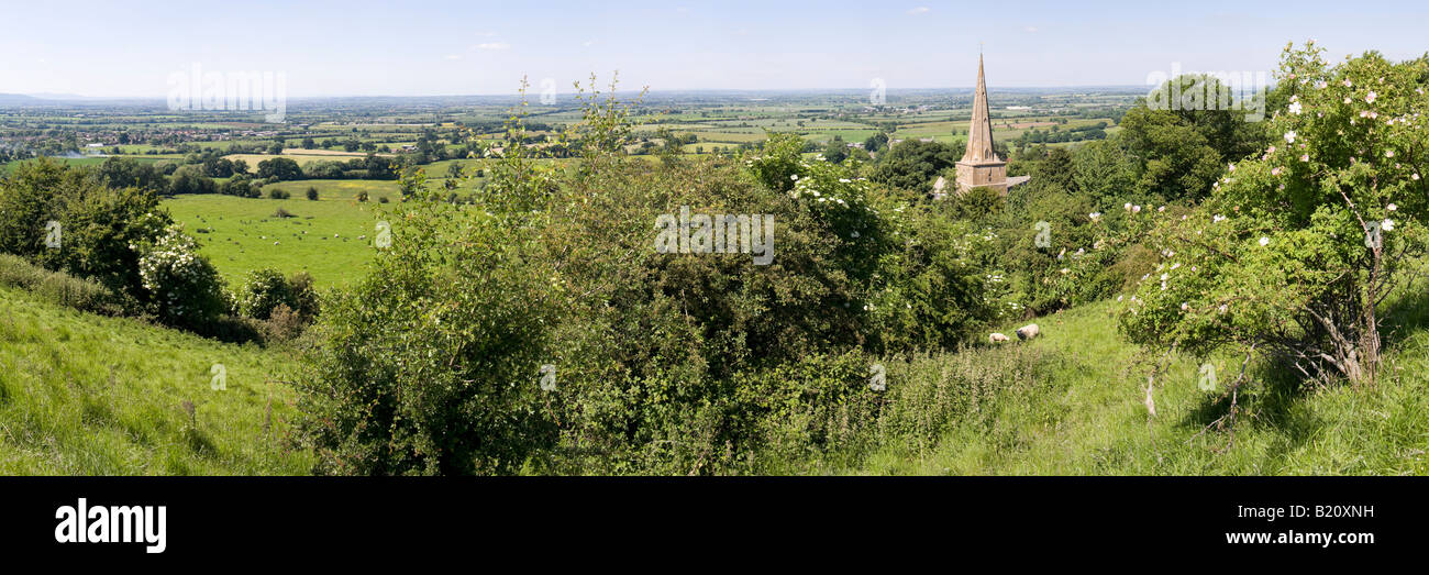 Looking across St Nicholas church in the Cotswold village of Saintbury ...