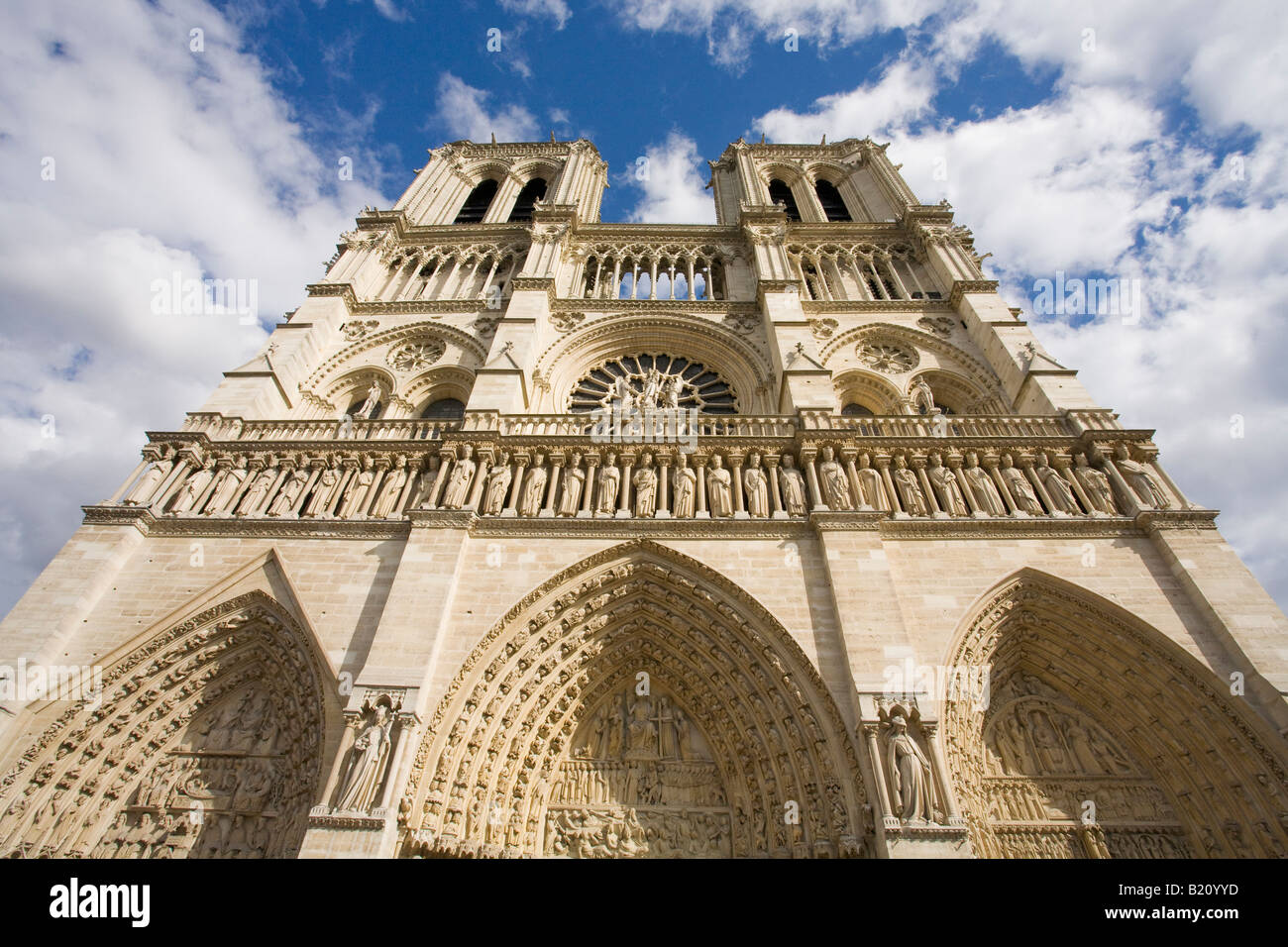 Notre Dame Cathedral exterior west entrance facade and towers in spring ...