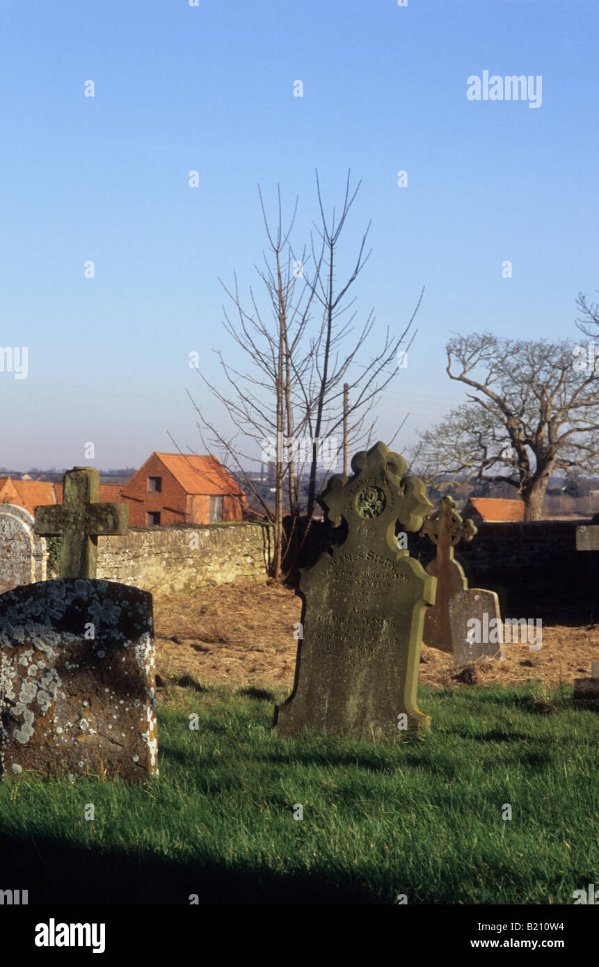 Gravestone in English graveyard in winter sun Stock Photo - Alamy