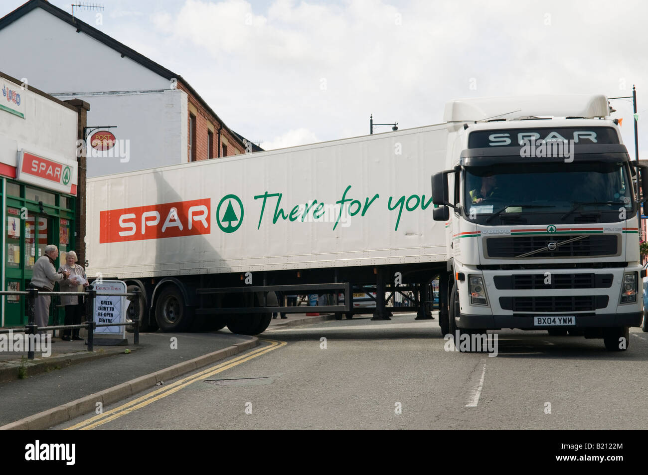 Articulated lorry blocking the road delivering supplies to the Spar ...