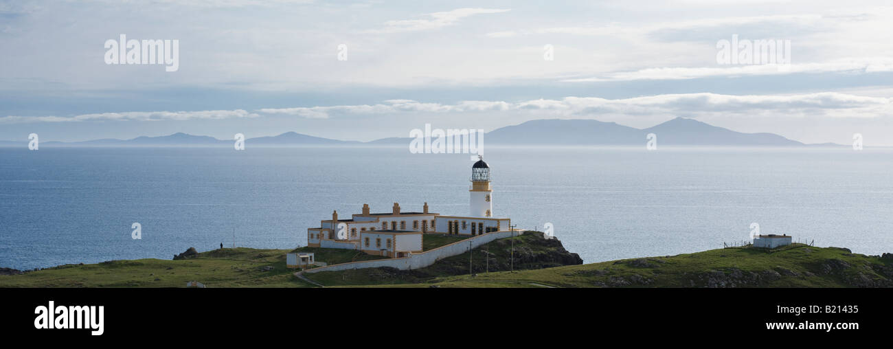 Neist Point lighthouse and view across waters of the Little Minch to ...