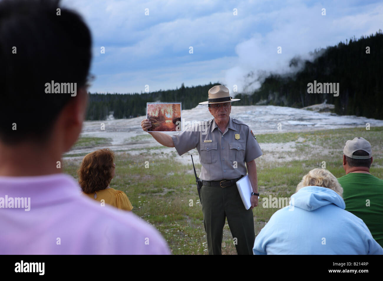 Yellowstone park ranger gives presentation to tourists in front of Old ...